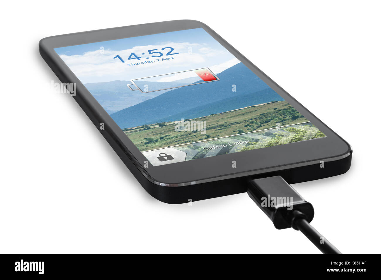 Closeup of smart phone connected to charger on white background Stock ...