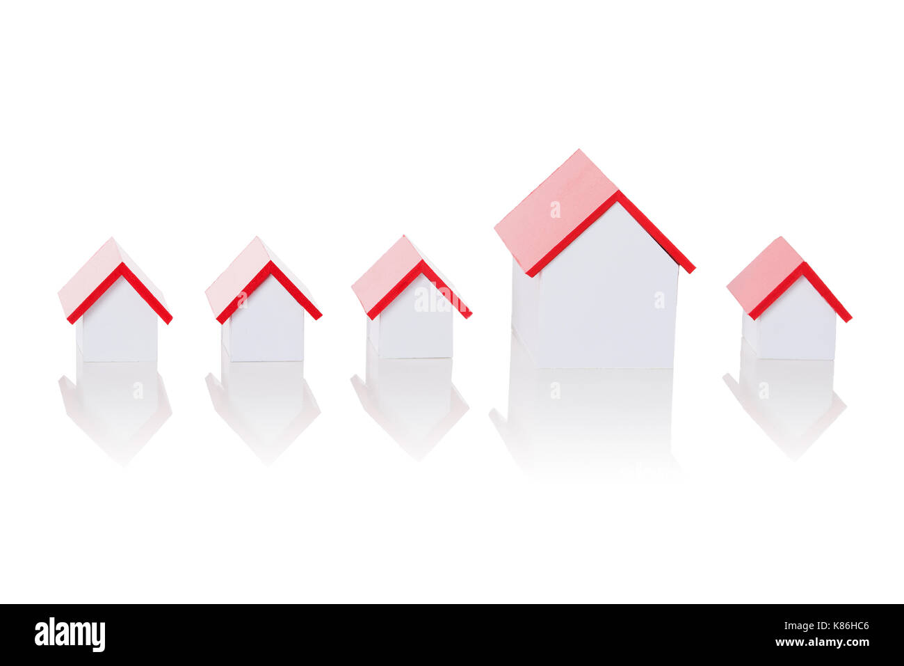 House model arranged in row against white background Stock Photo - Alamy