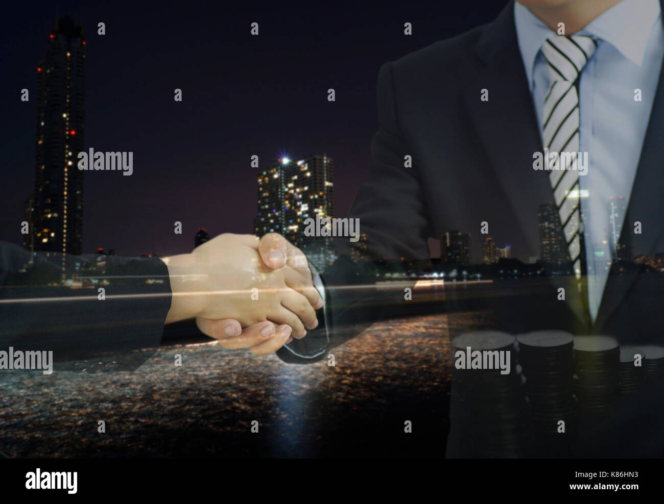 double exposure businessman shaking hand and night city, concept in ...