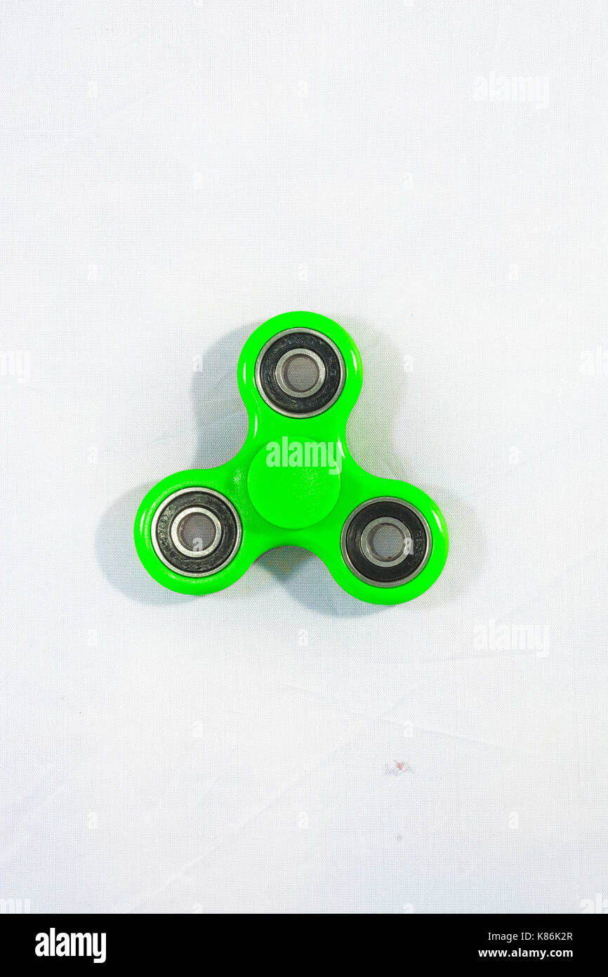 Fidget Spinner in white isolated background. The fidget spinner is a ...