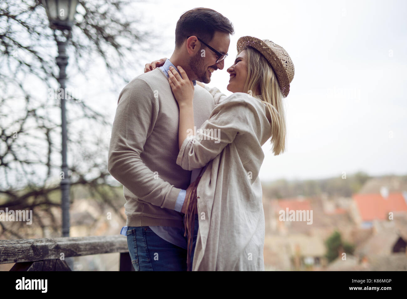 Happy couple in love hugging outdoor Stock Photo - Alamy