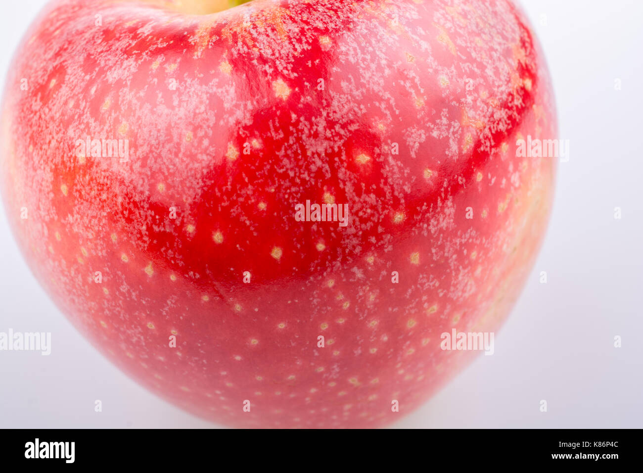 Red apple with dots in close up view Stock Photo - Alamy