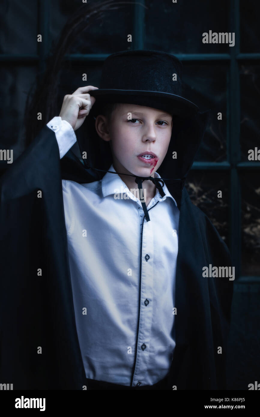 Elegant vampire in a hat Stock Photo - Alamy