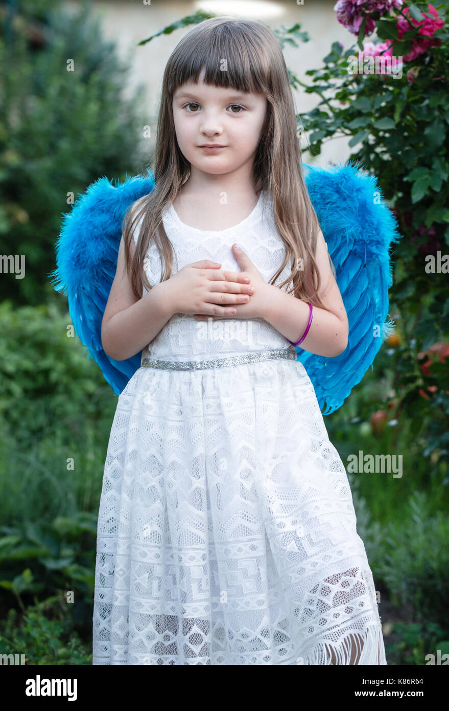 Girl in angel wings face hi-res stock photography and images - Alamy