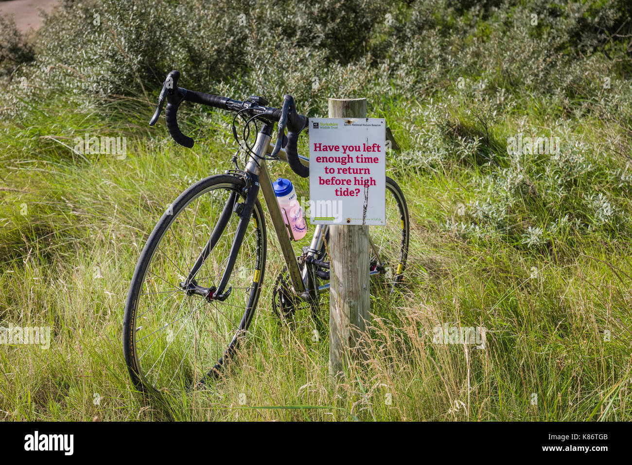 High tide warning sign at Spurn Head, East Yorkshire, UK Stock Photo ...