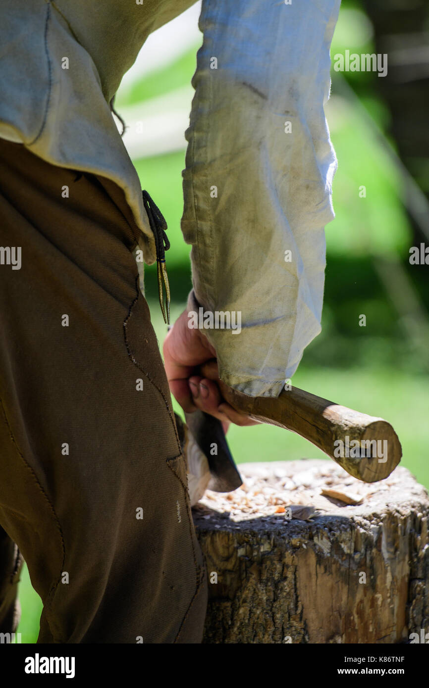 Man using axe Stock Photo - Alamy