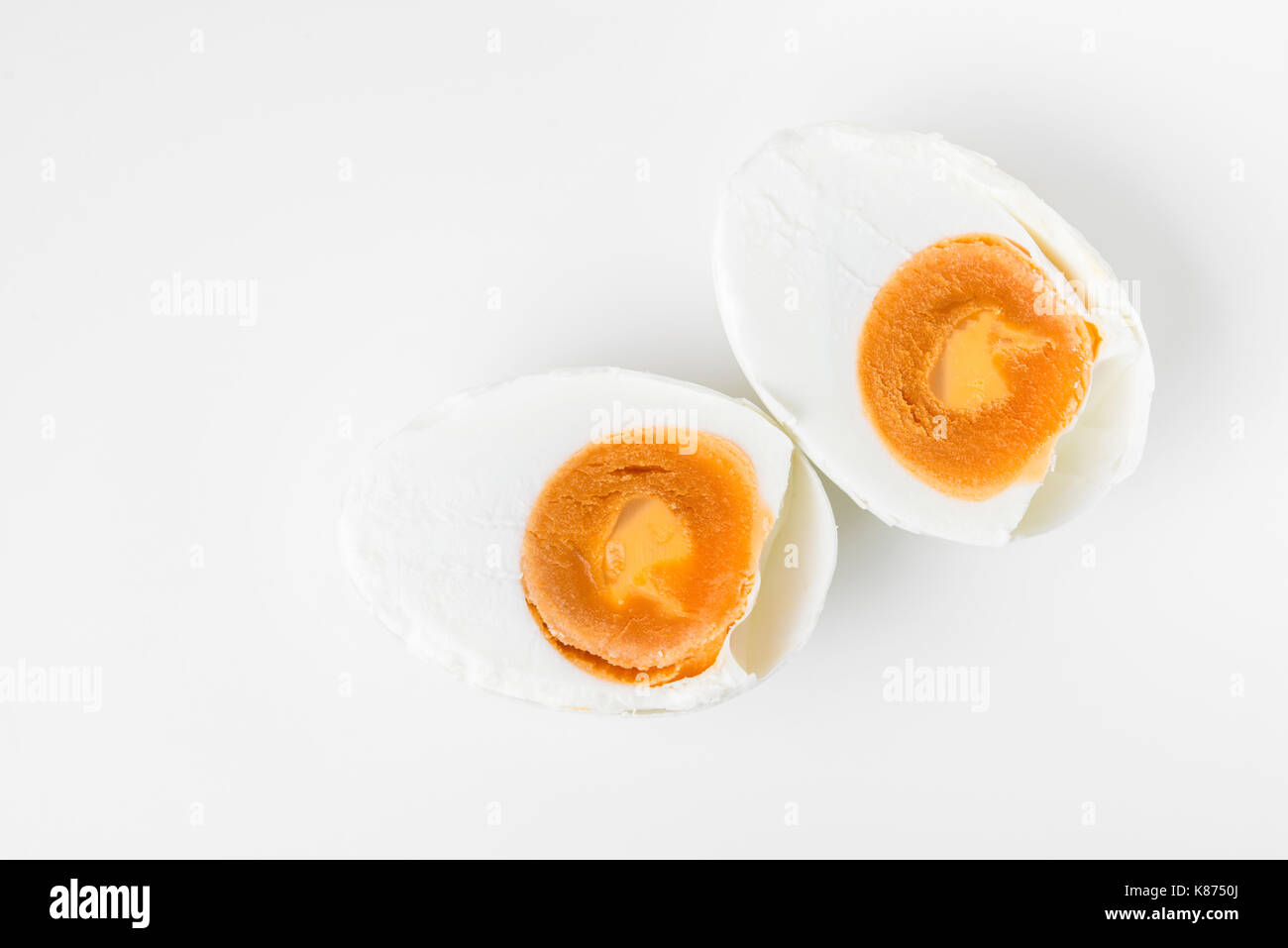 salted egg isolated on white Stock Photo - Alamy
