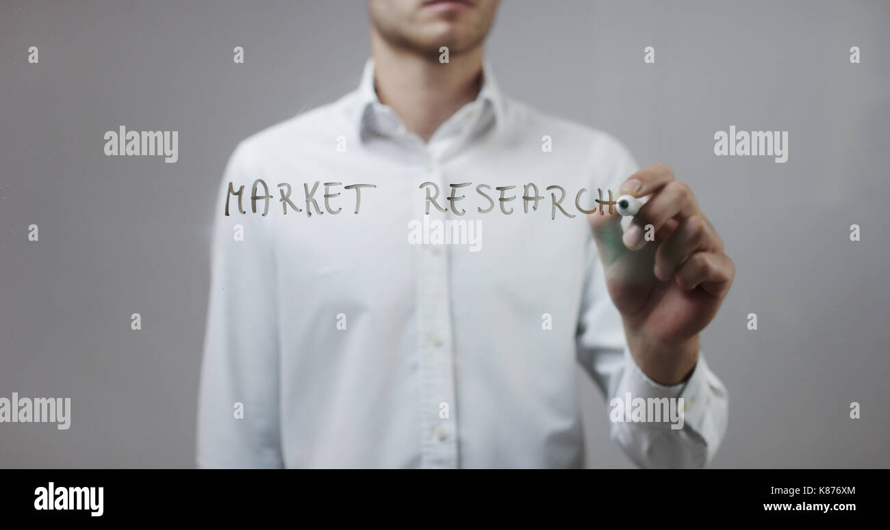 Market research , Man Writing on Glass Stock Photo - Alamy
