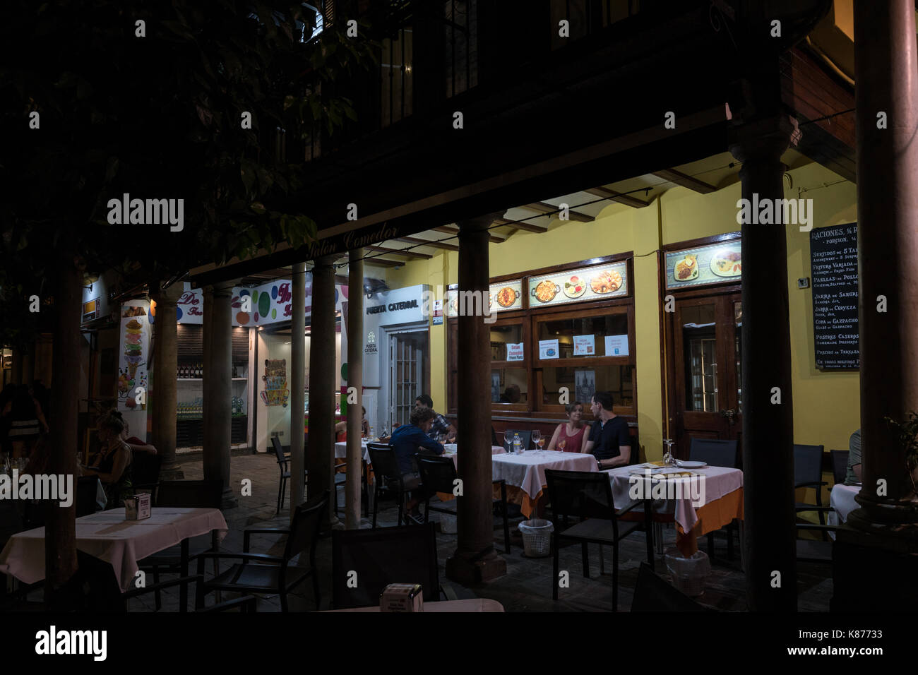 Street cafe in Seville at night. Seville, Andalucia, Spain Stock Photo ...