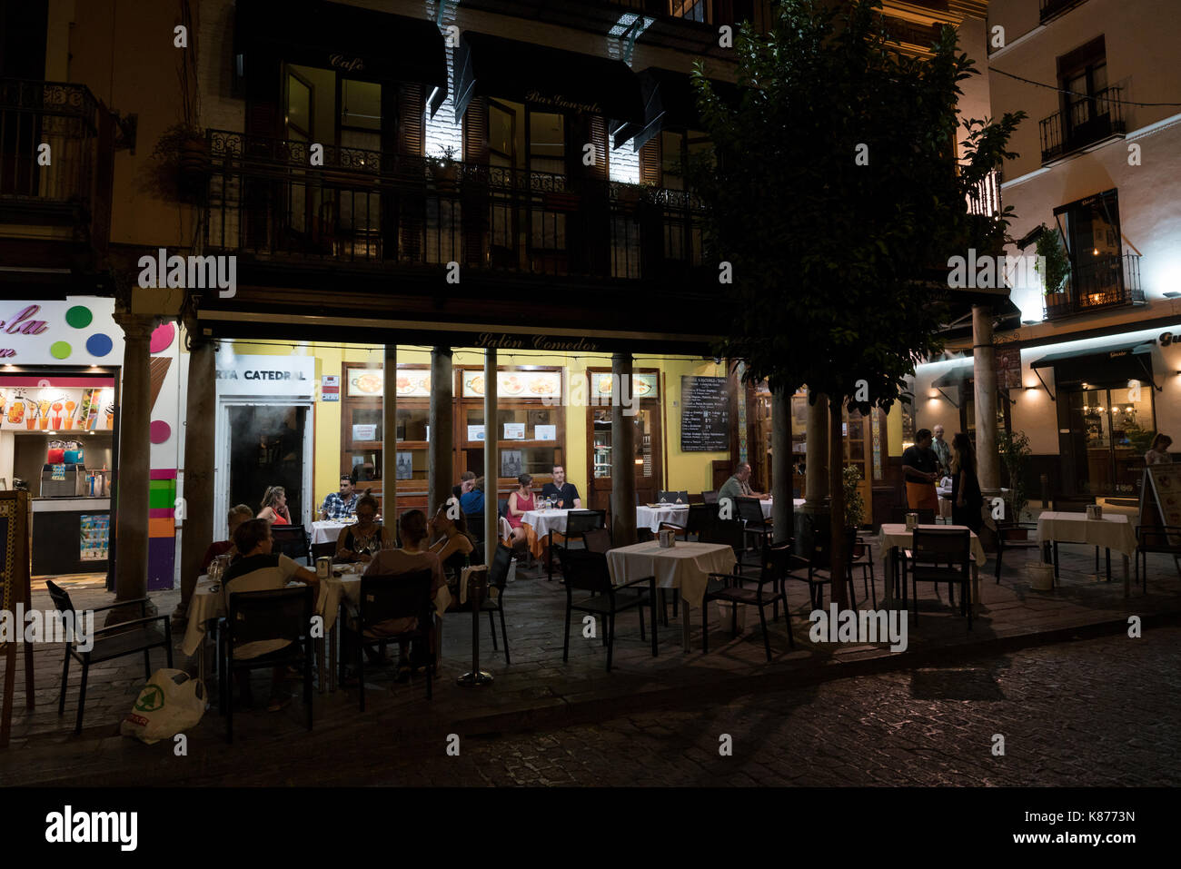 Street cafe in Seville at night. Seville, Andalucia, Spain Stock Photo ...