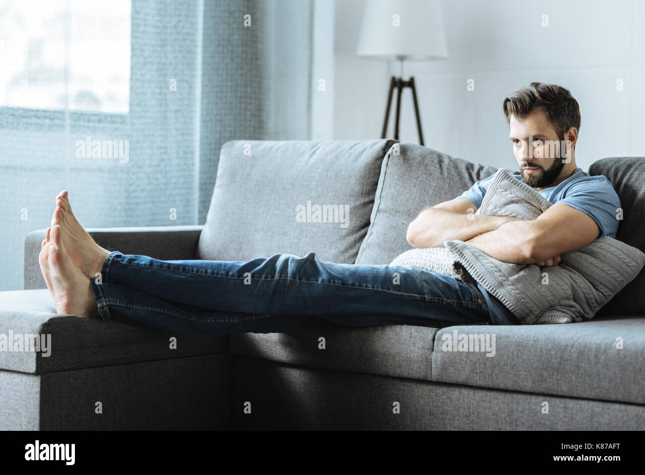 Cheerless unhappy man suffering hi-res stock photography and images - Alamy