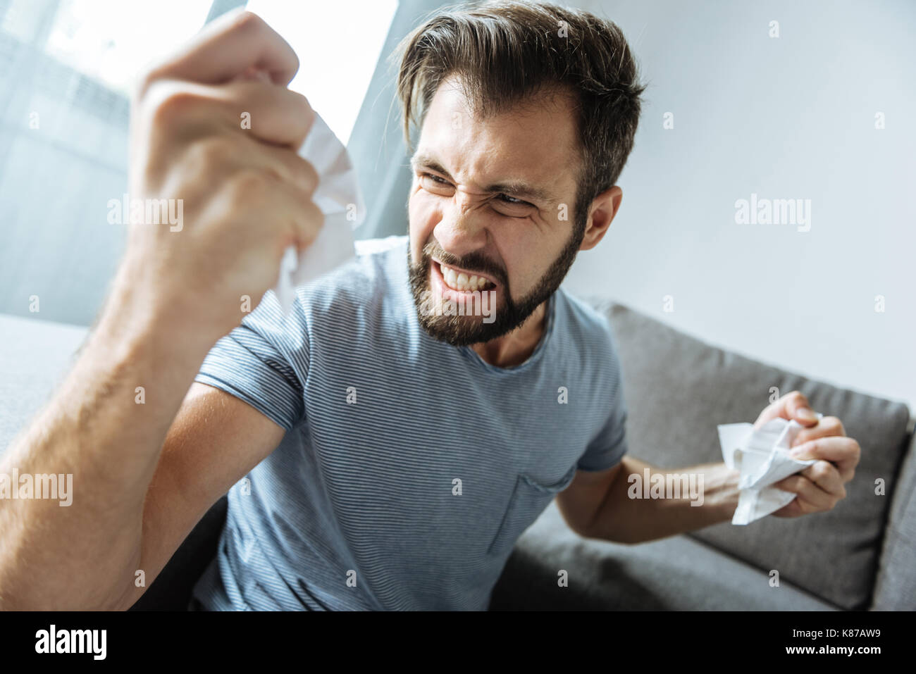 Angry unhappy man clenching his teeth Stock Photo - Alamy