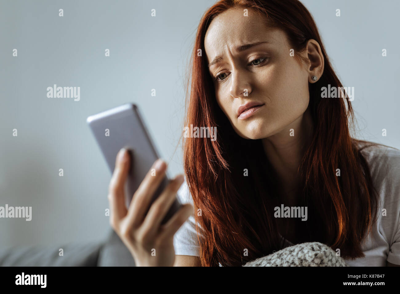 Cheerless upset woman suffering hi-res stock photography and images - Alamy