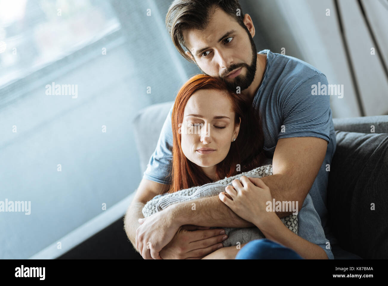 Woman being hugged hi-res stock photography and images - Alamy