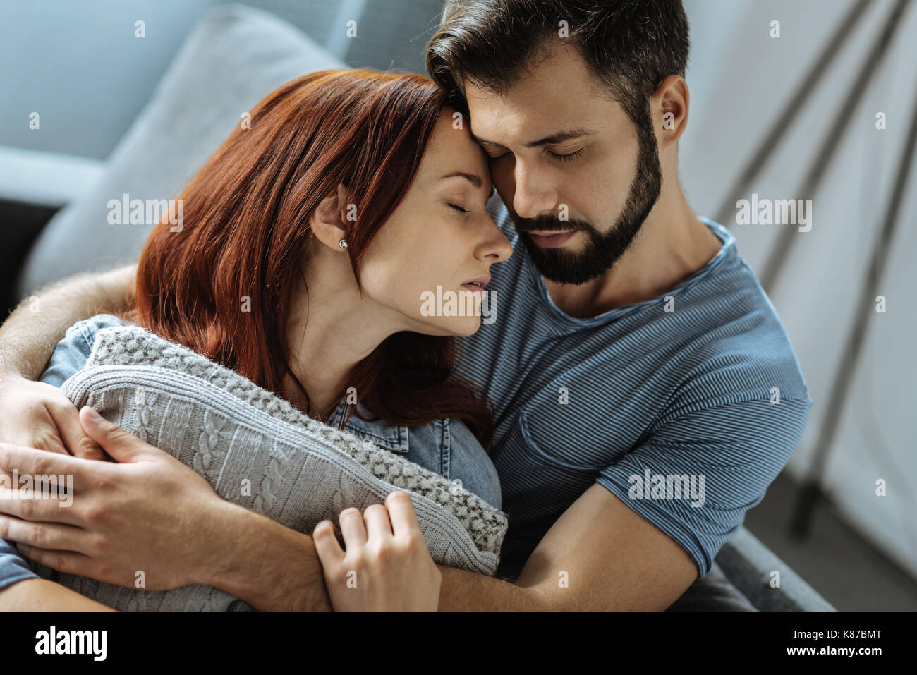 Calm couple hugging eyes hi-res stock photography and images - Alamy