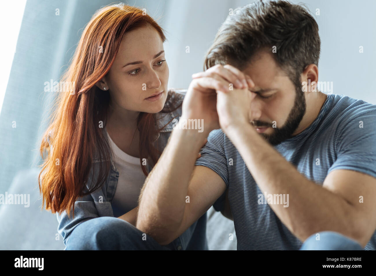 Nice pleasant woman being worried about her boyfriend Stock Photo - Alamy