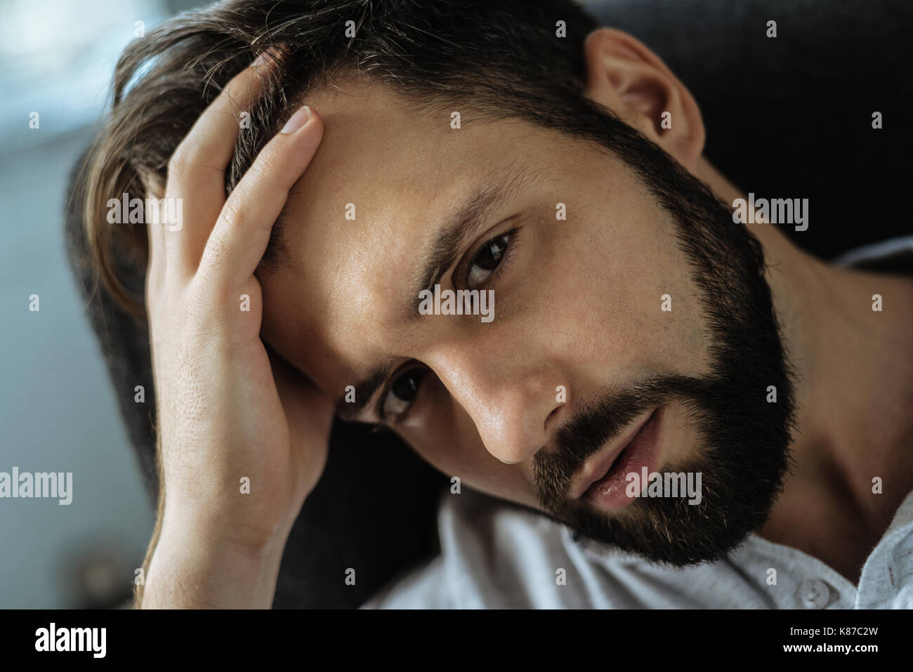 Portrait of a handsome gloomy man looking at you Stock Photo - Alamy