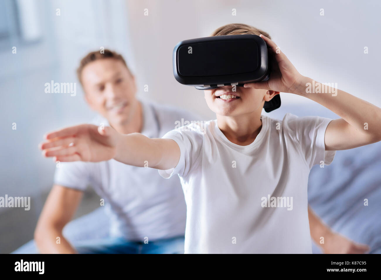 Happy little boy wearing a VR headset Stock Photo - Alamy