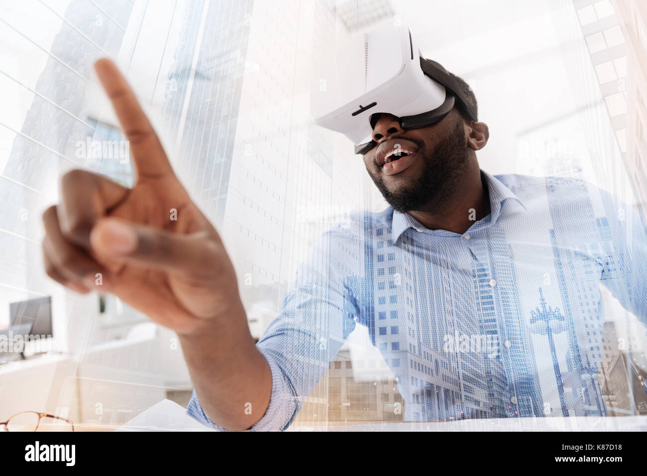 Curious man wearing virtual glasses Stock Photo - Alamy