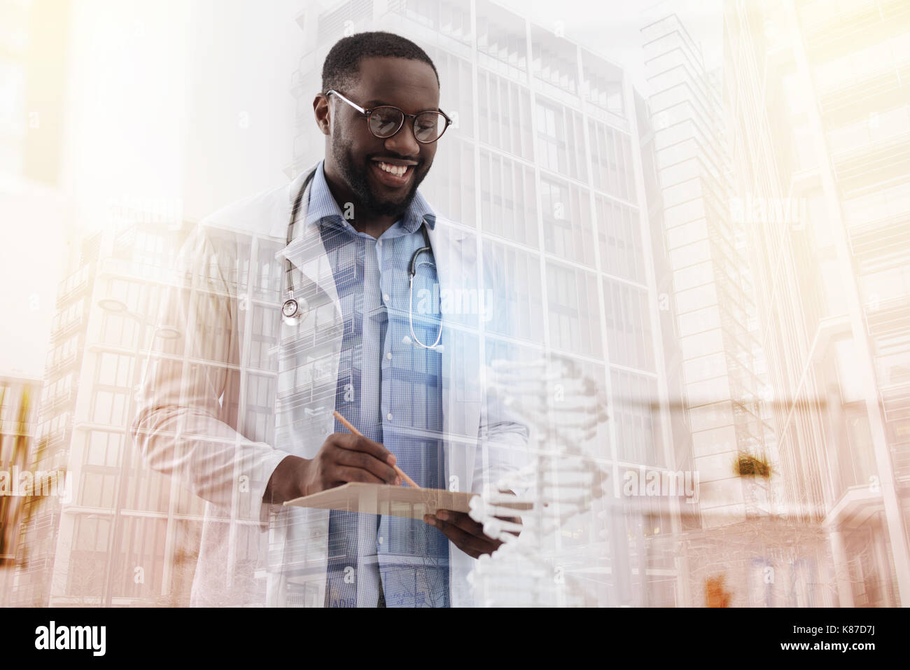 Experienced doctor busy with documents Stock Photo - Alamy