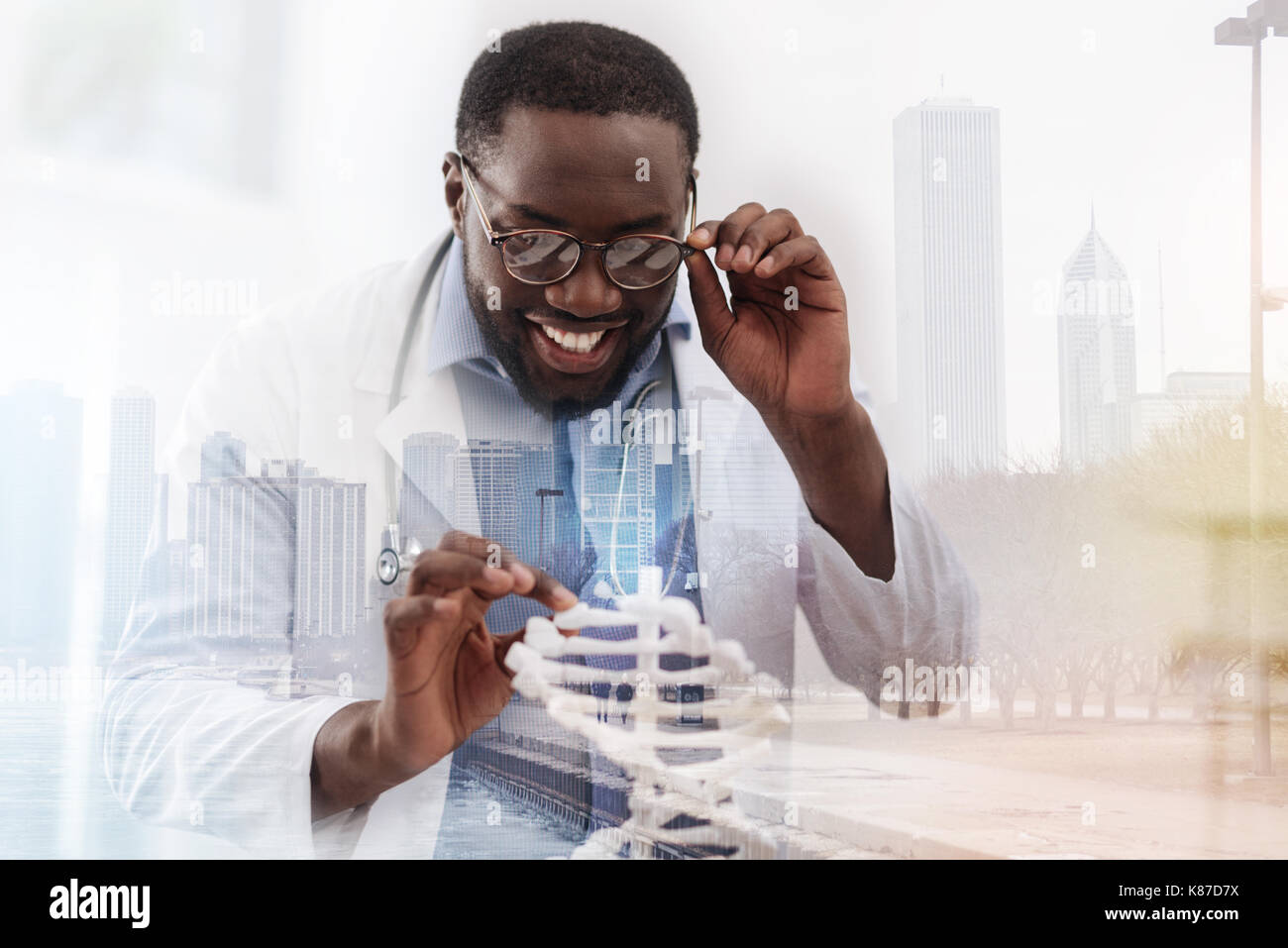 Curious doctor touching genome model Stock Photo - Alamy