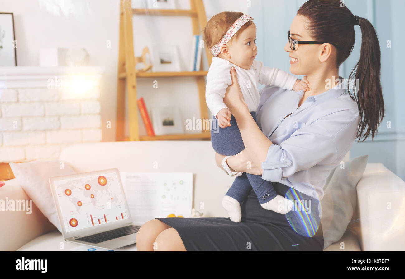 Unmarried woman laying with her baby Stock Photo - Alamy