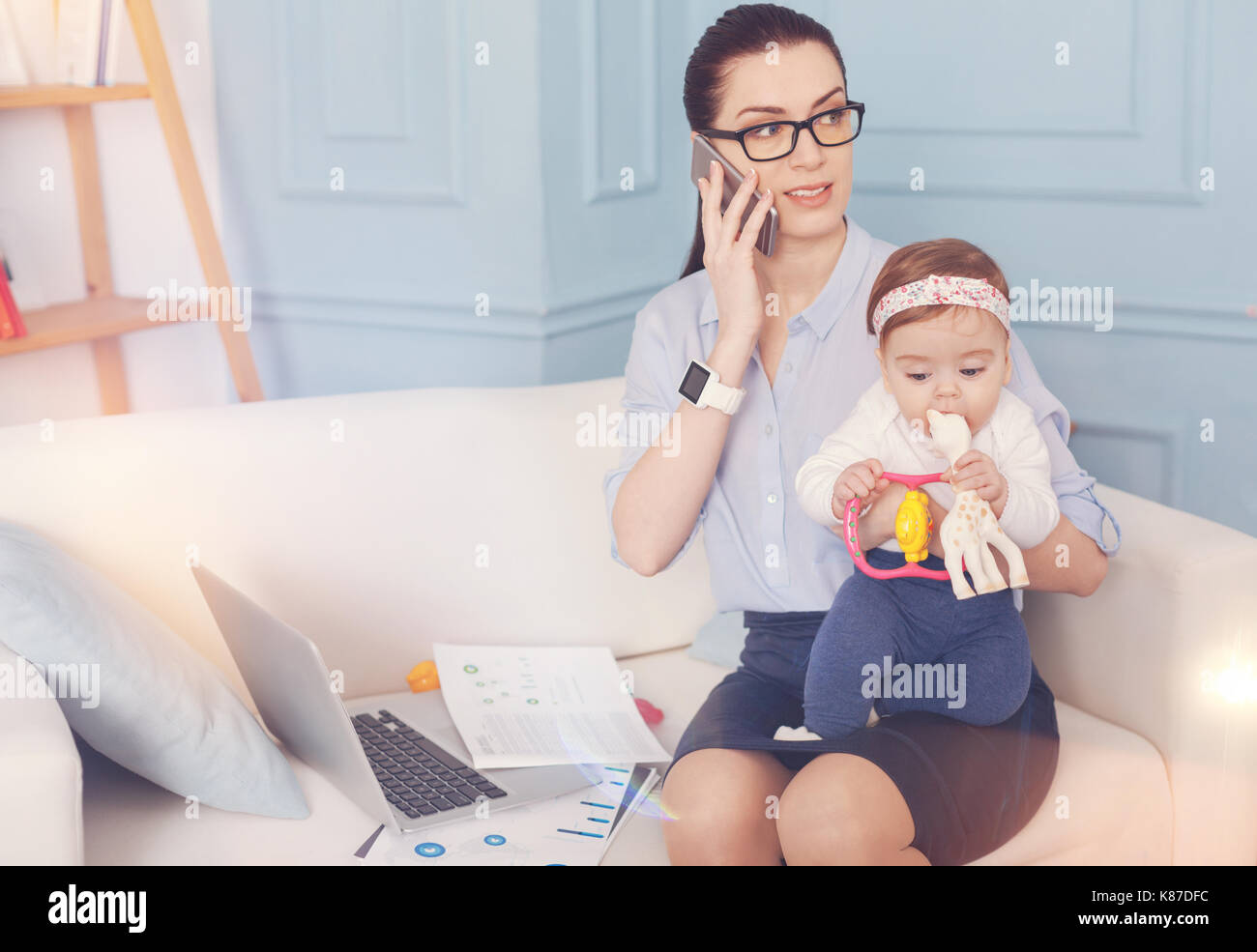 Busy brunette having telephone call Stock Photo - Alamy