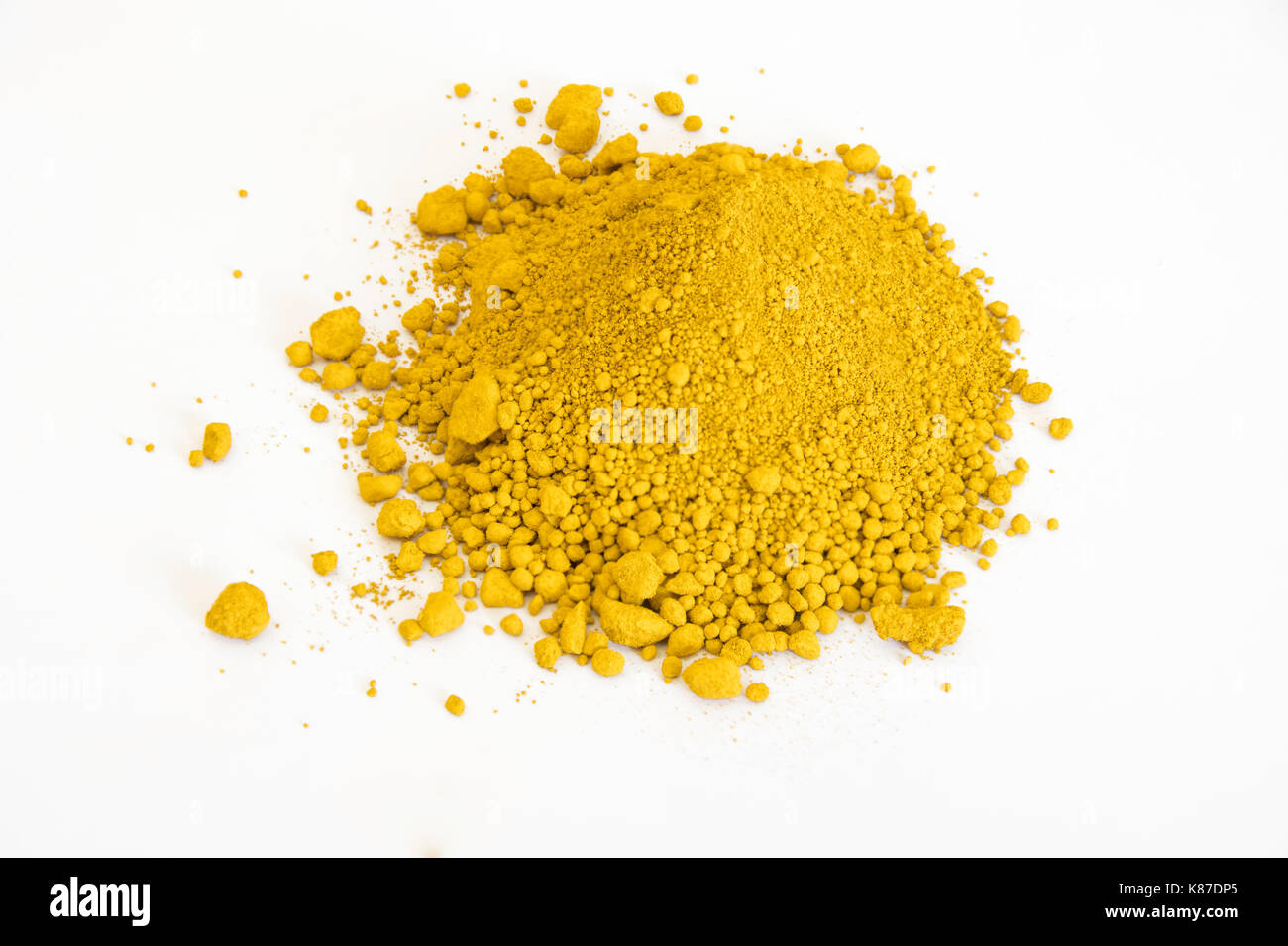extreme close up of yellow pigment isolated over white background Stock ...