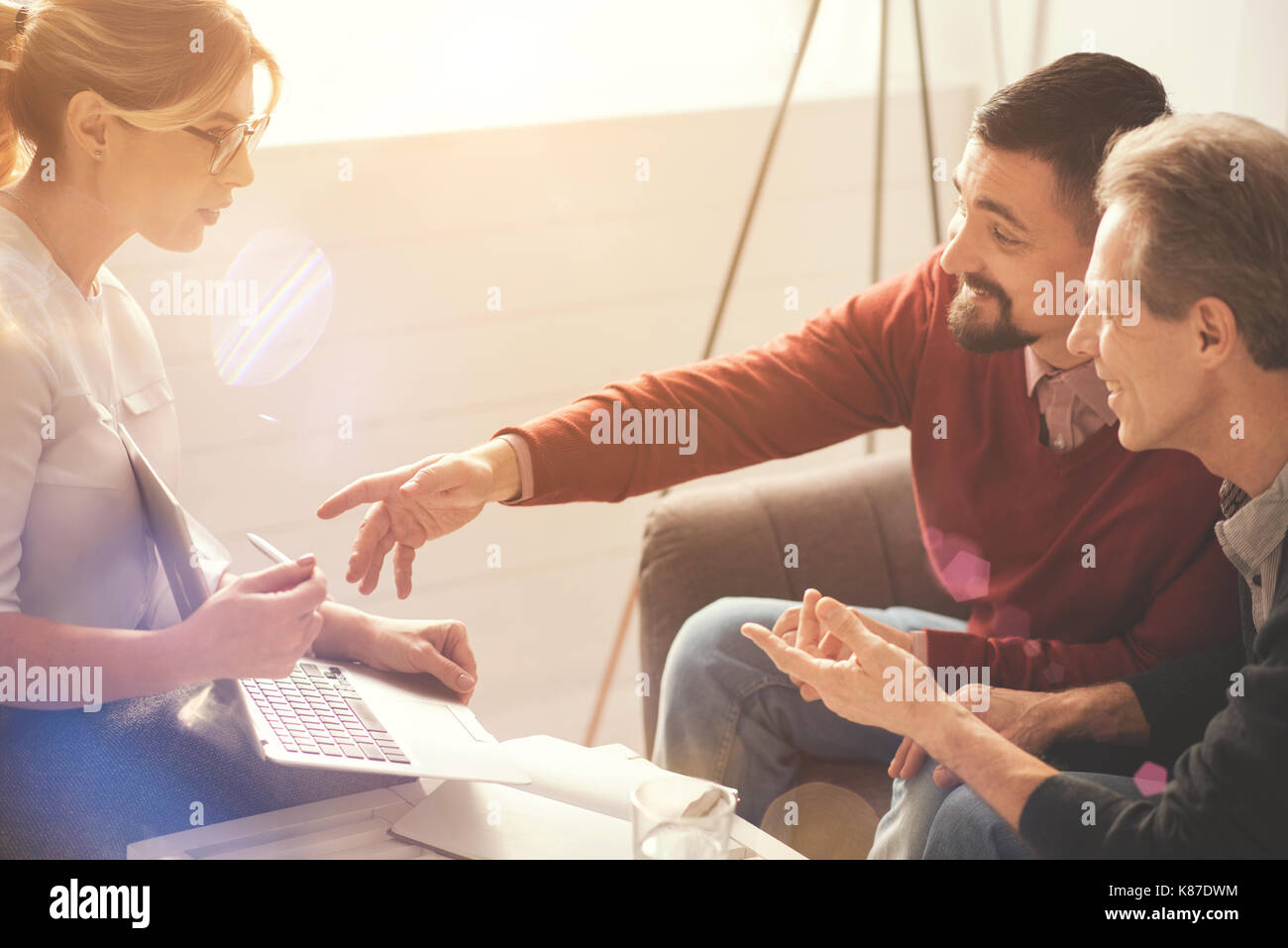 Joyful happy men looking at the laptop screen Stock Photo - Alamy