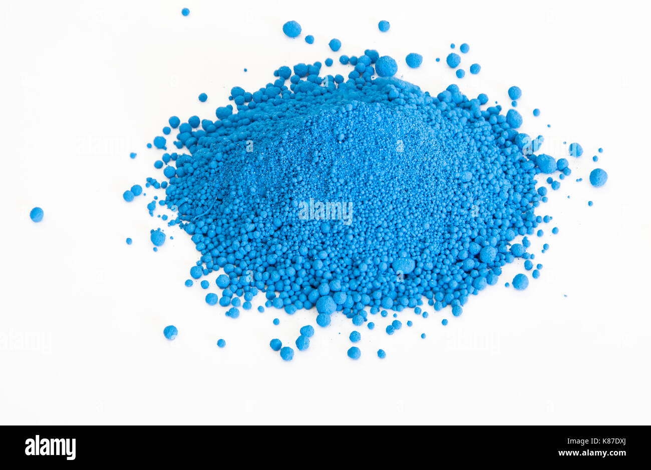 extreme close up of blue pigment isolated over white background Stock ...