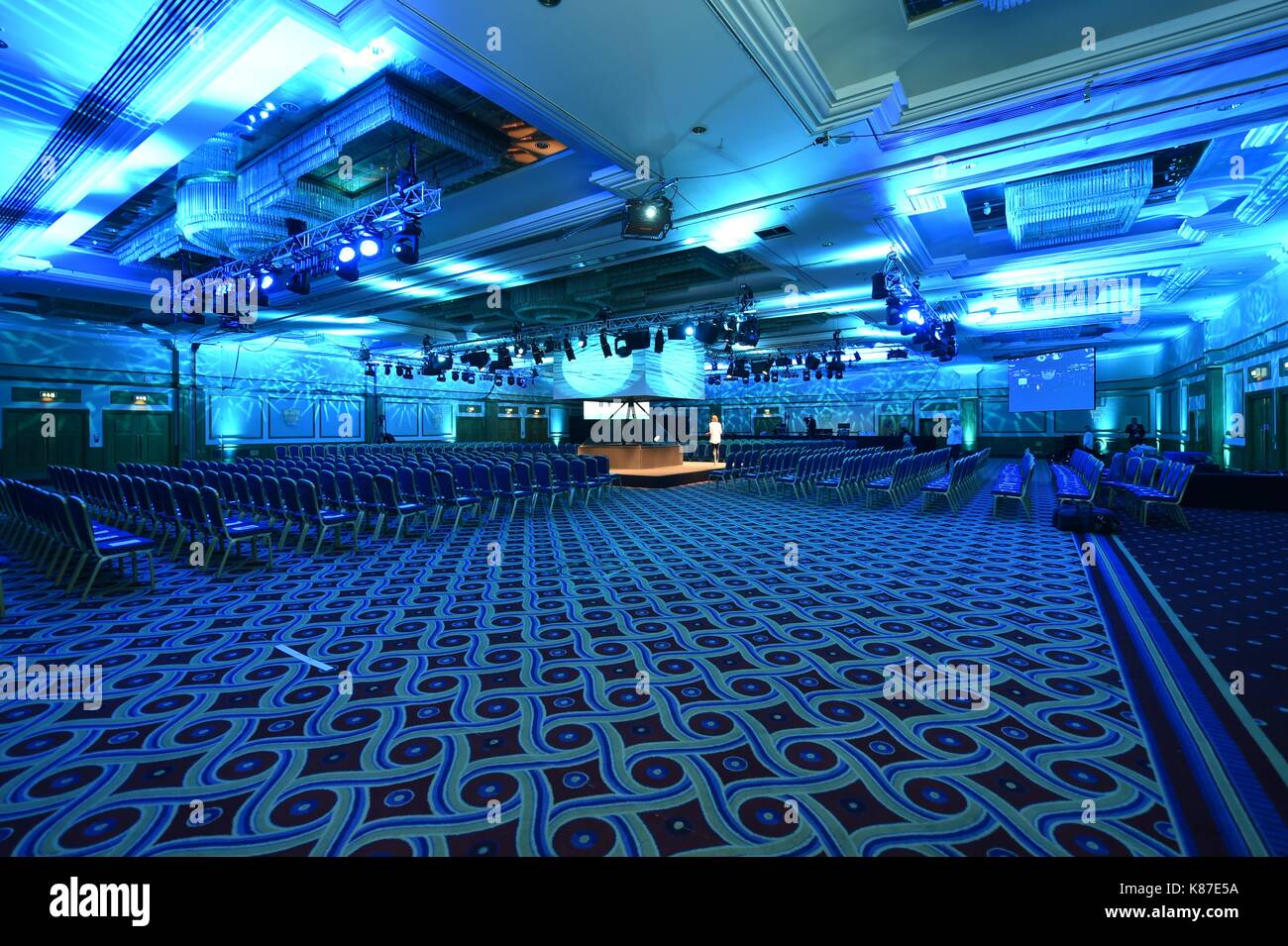 Empty conference room with house lights on Stock Photo - Alamy