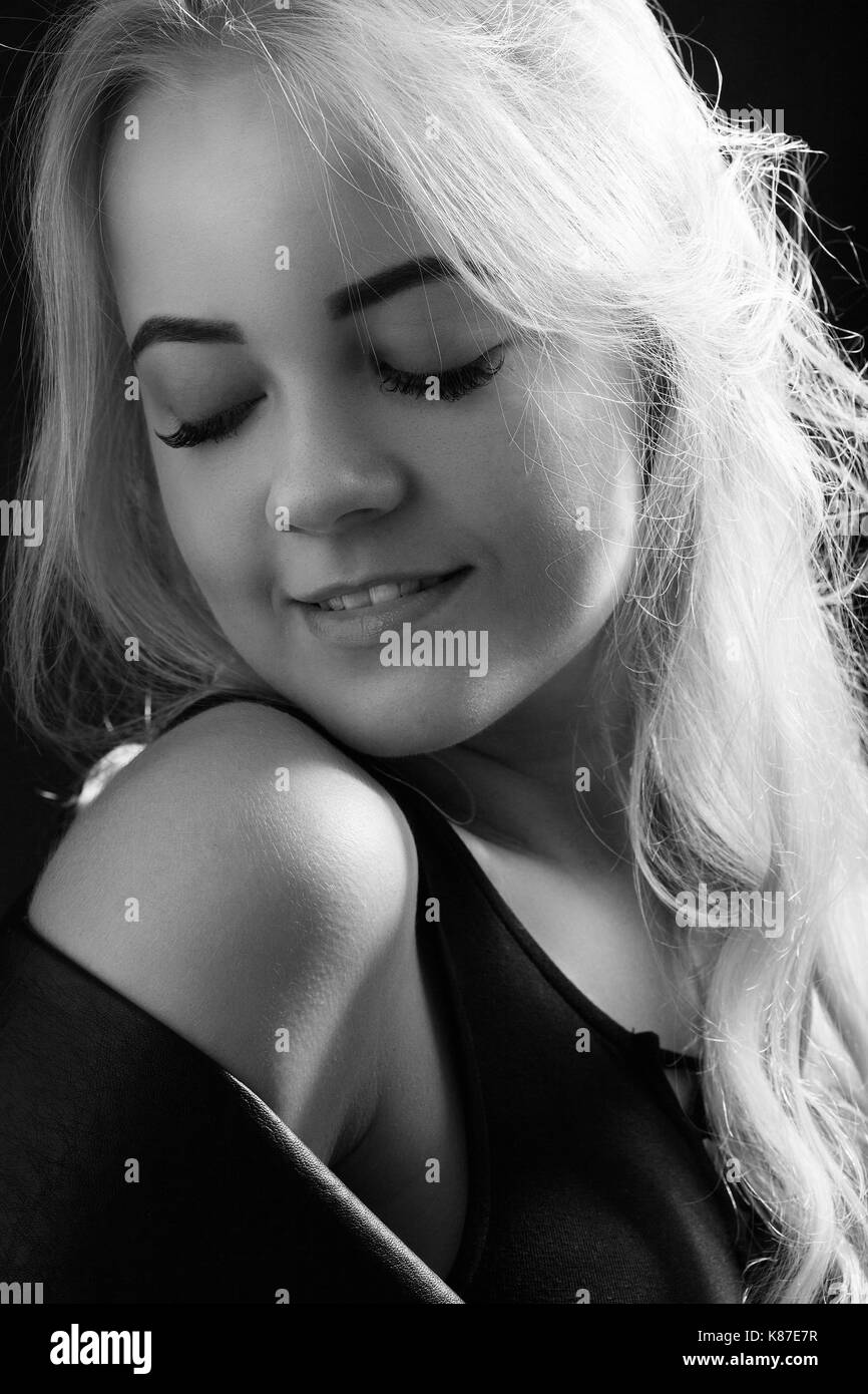 Beautiful Young Blond Female Portrait On Black Background Monochrome