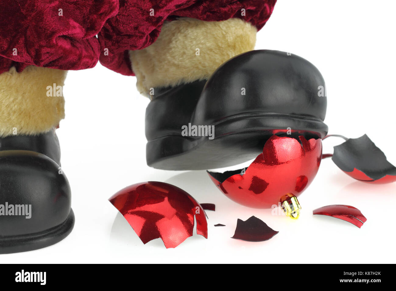 Santa Claus is breaking a Christmas ornament Stock Photo - Alamy