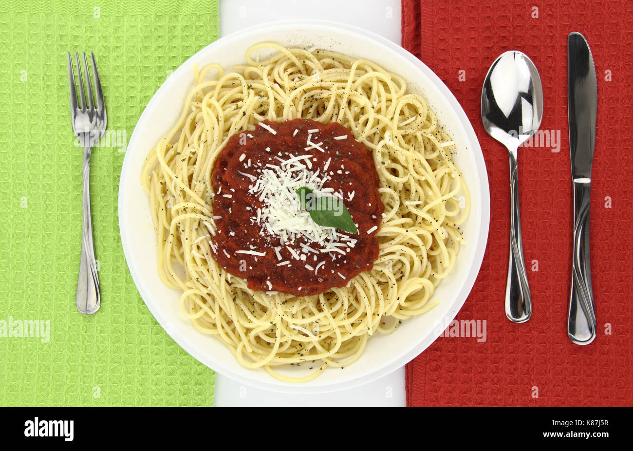Spaghetti over Italian flag colors background Stock Photo - Alamy