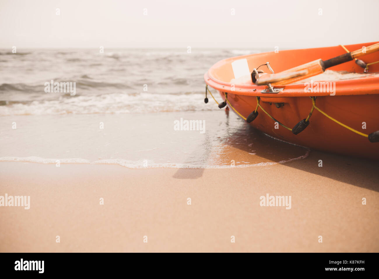 Orange lifeguard rescue boat on the beach in summer Stock Photo - Alamy