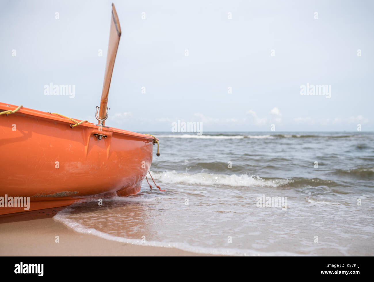 Orange lifeguard rescue boat on the beach in summer Stock Photo - Alamy