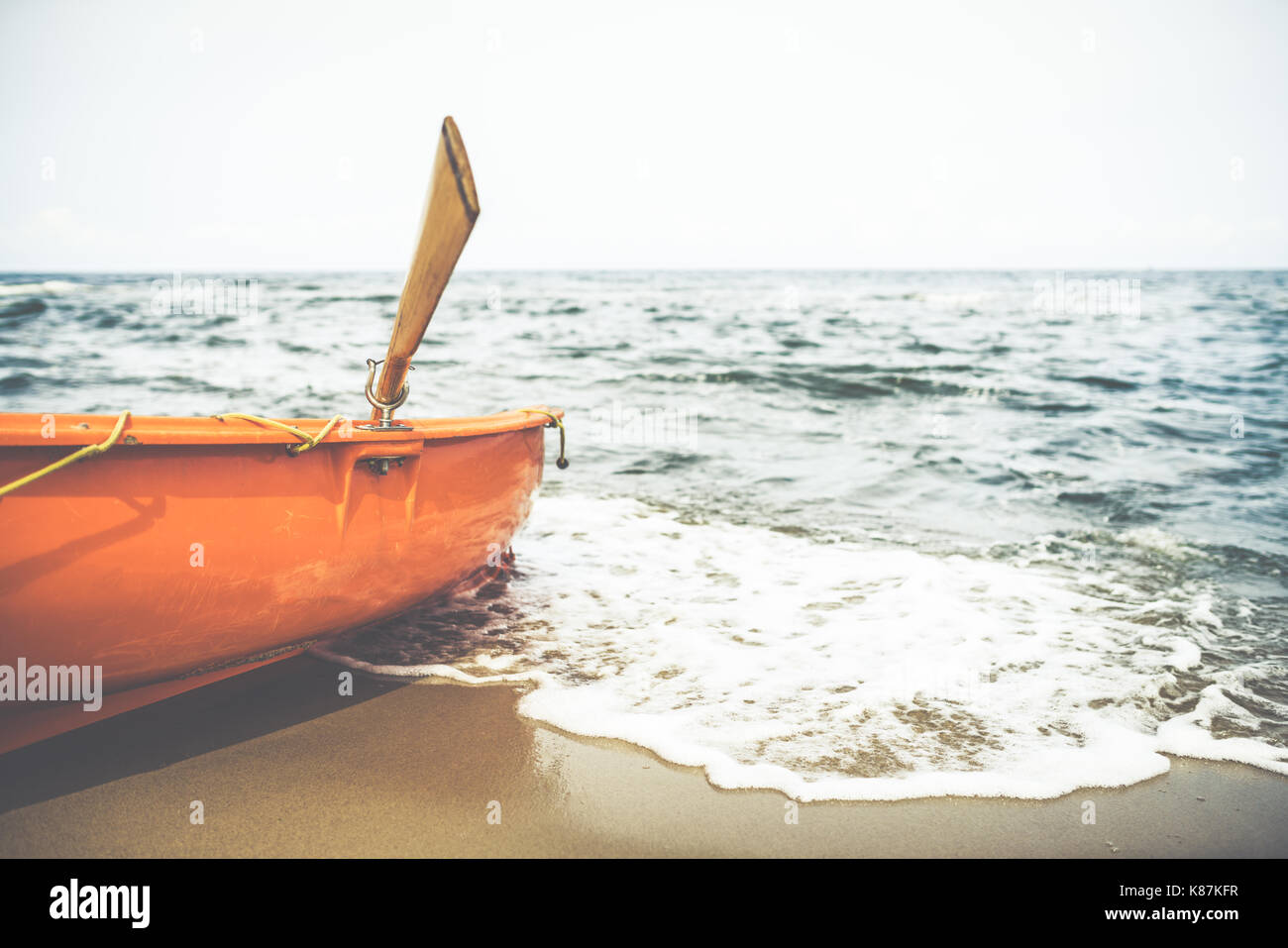 Orange lifeguard rescue boat on the beach in summer Stock Photo - Alamy