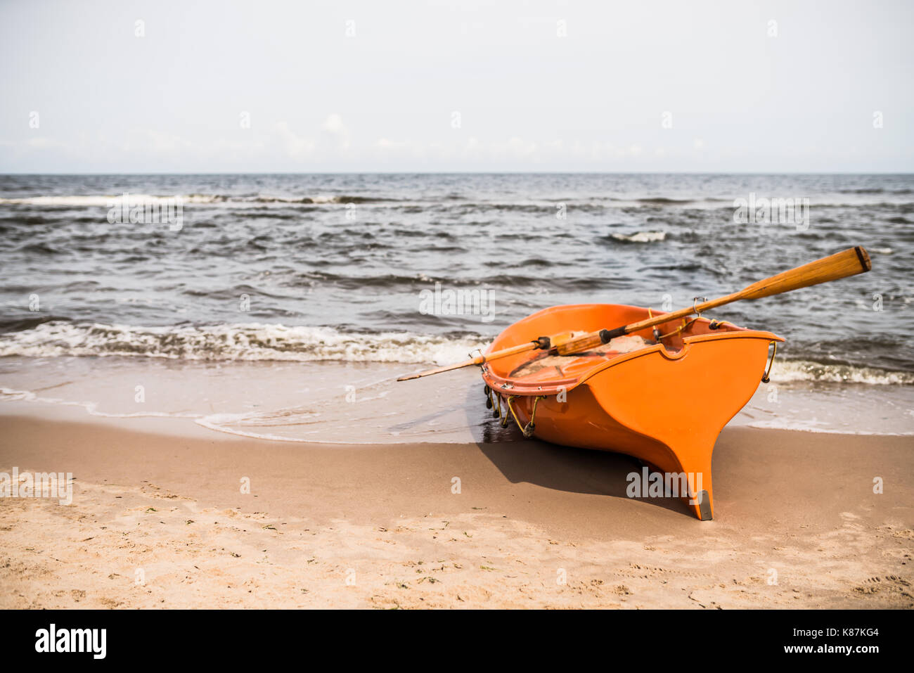 Orange lifeguard rescue boat on the beach in summer Stock Photo - Alamy