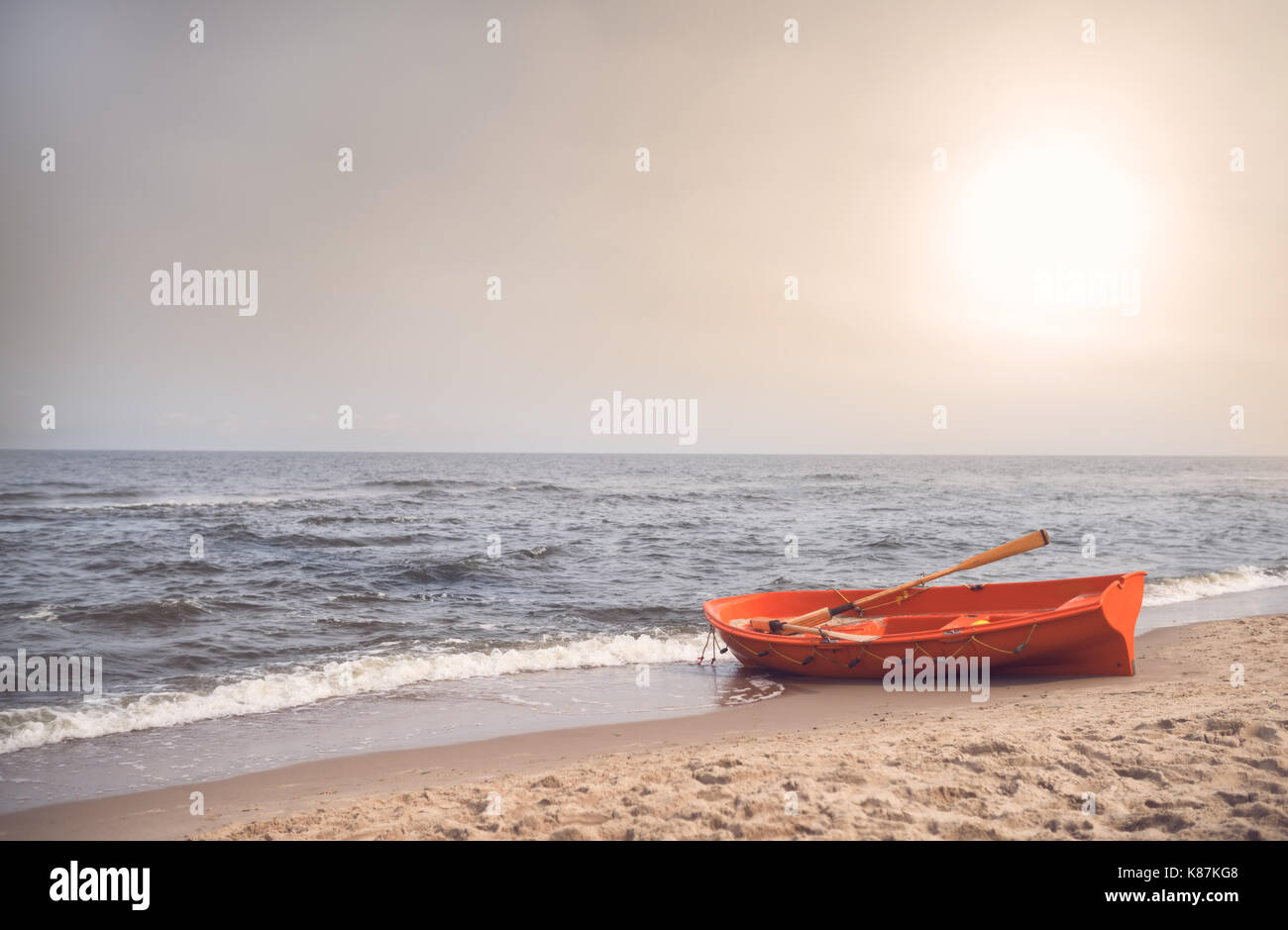 Orange lifeguard rescue boat on the beach in summer Stock Photo - Alamy