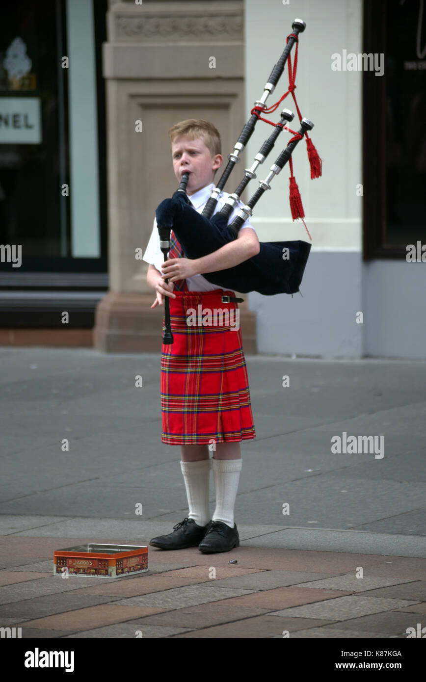 young boy child piper kilted royal Stewart tartan busker musician on ...