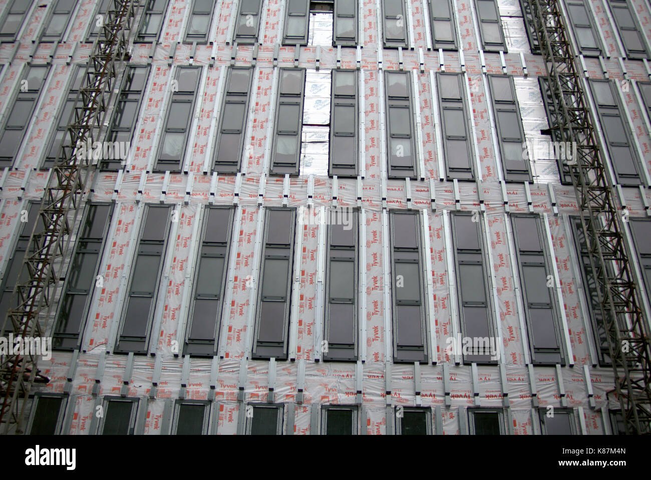 external of building under construction showing the cladding Stock ...