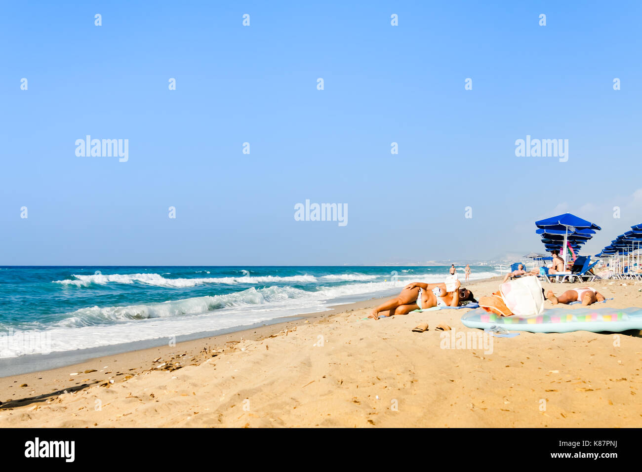 Greece beach sunbathing woman hi-res stock photography and images - Alamy