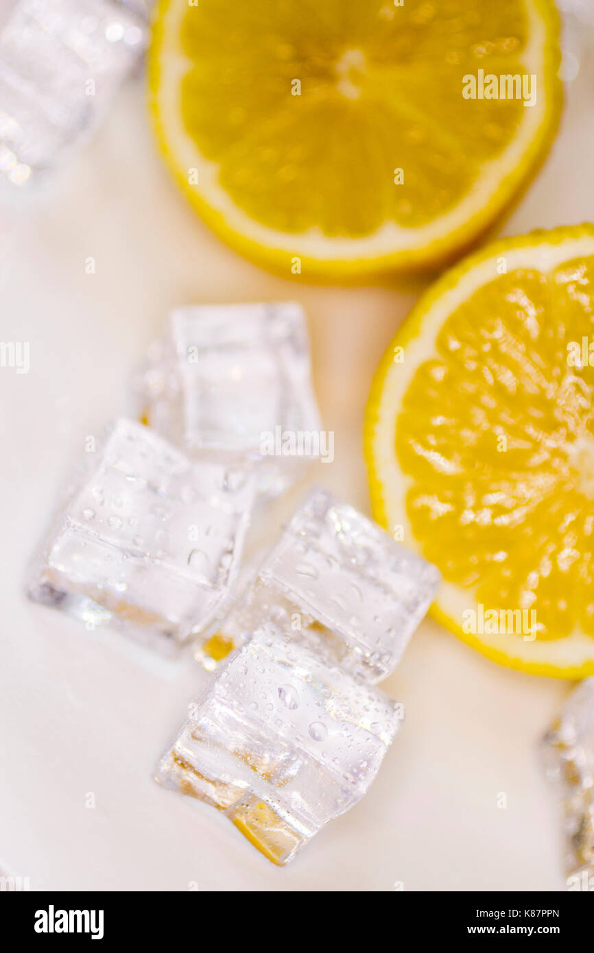 Lemon with ice cubes in a bowl Stock Photo - Alamy