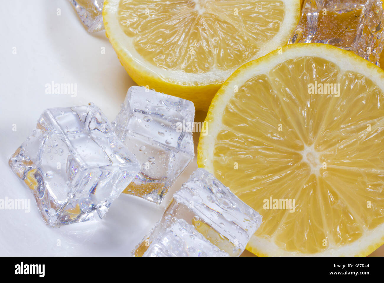 Lemon with ice cubes in a bowl Stock Photo - Alamy