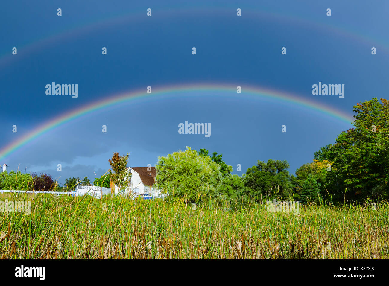 Double rainbow over a farm house in New York Stock Photo - Alamy