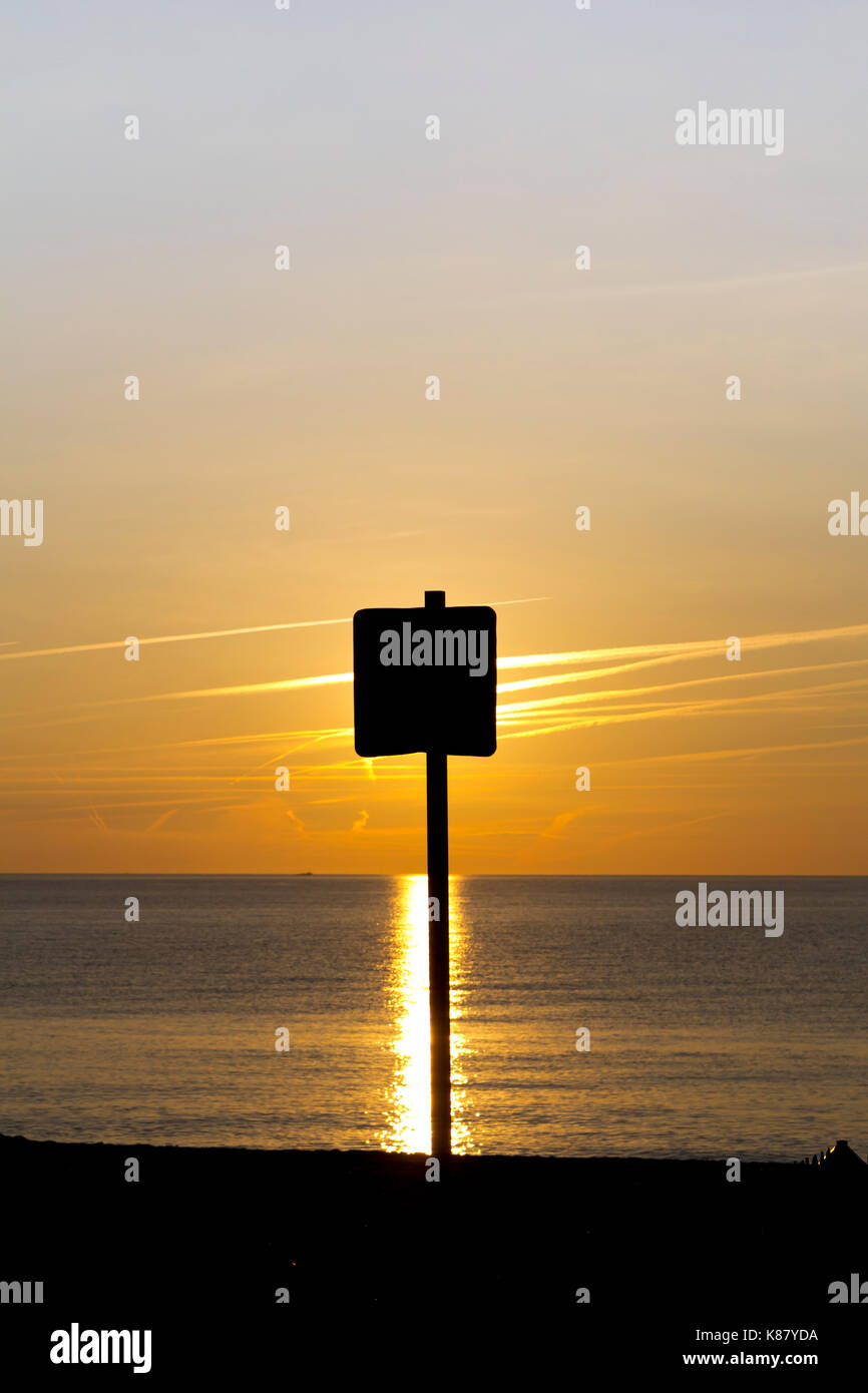 Dawn sun rising over a calm colorful Mediterranean sea Stock Photo - Alamy