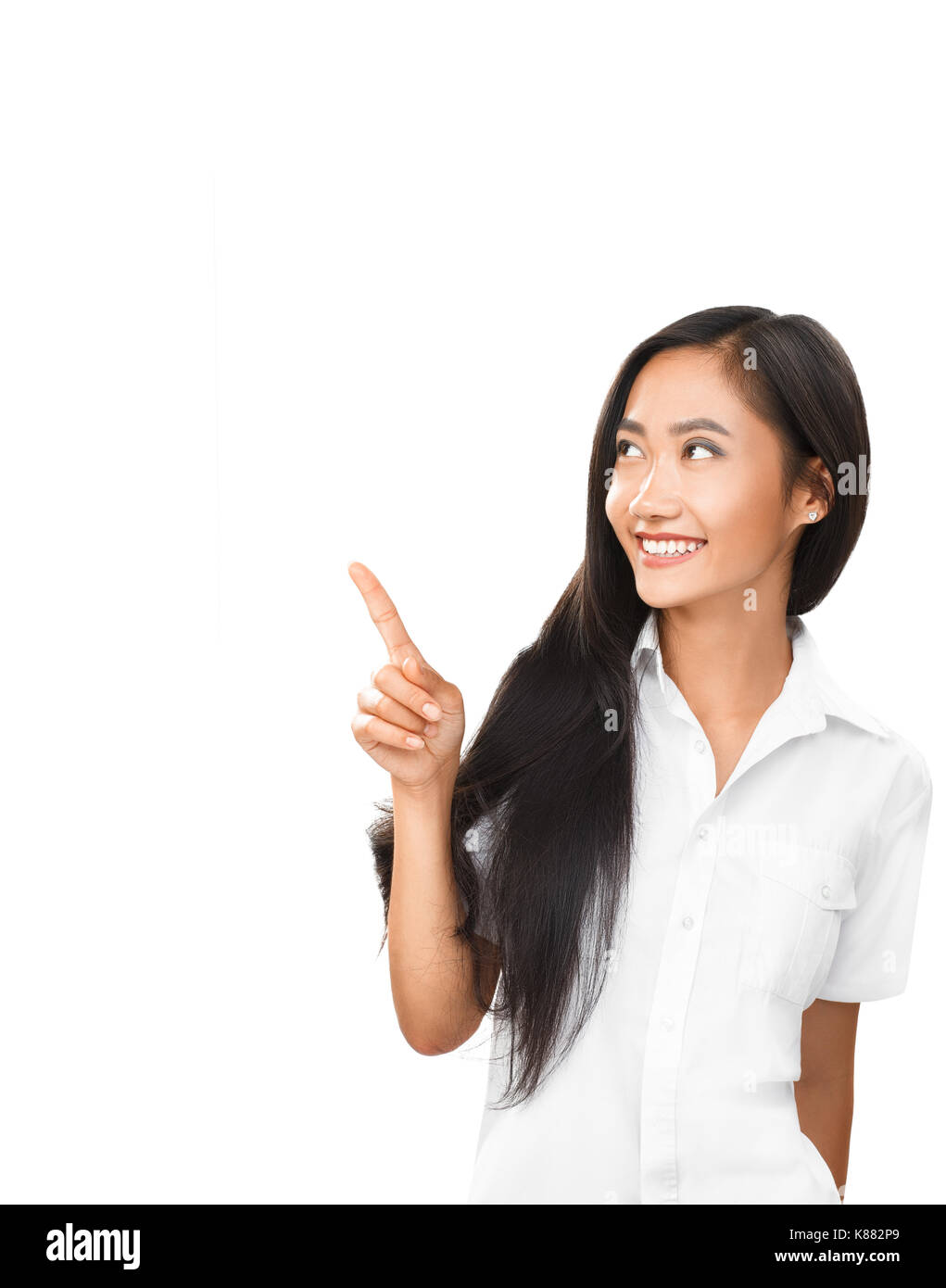 Young Asian woman pointing finger and looking in same direction. Photo ...