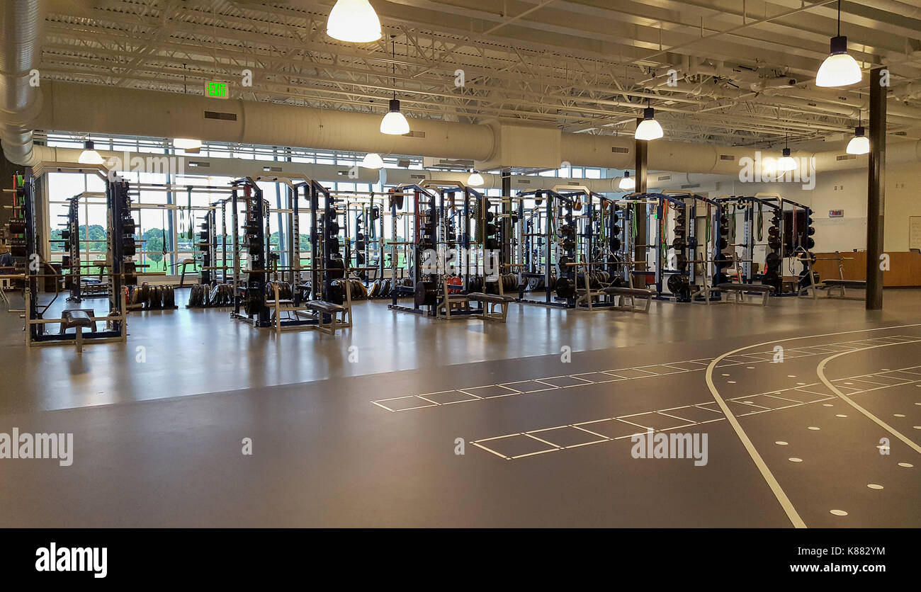 workout equipment and running track in high school gym Stock Photo ...