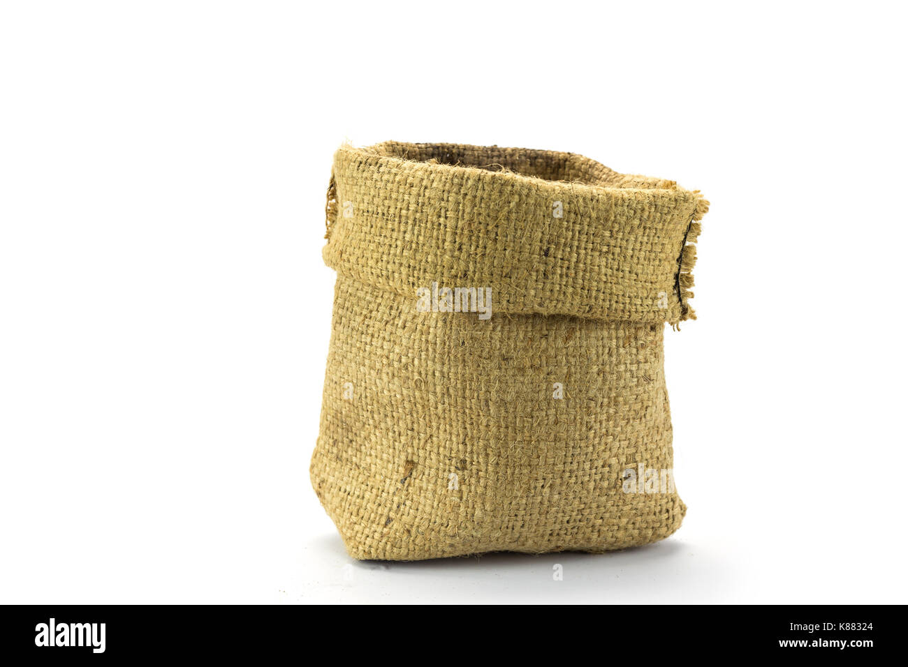 Open small sack isolated on white background Stock Photo - Alamy