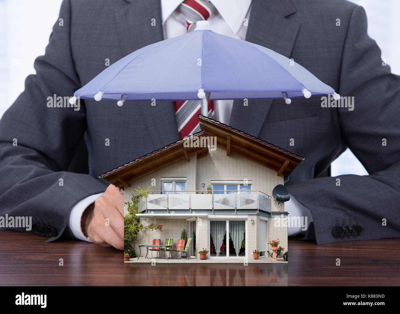Person umbrella house hi-res stock photography and images - Alamy